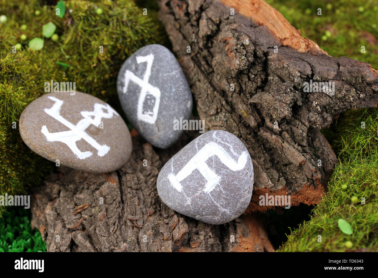 Fortune telling with symbols on stone close up Stock Photo - Alamy
