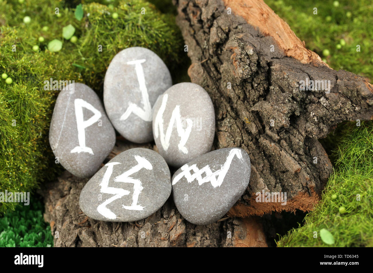 Fortune telling with symbols on stone close up Stock Photo - Alamy