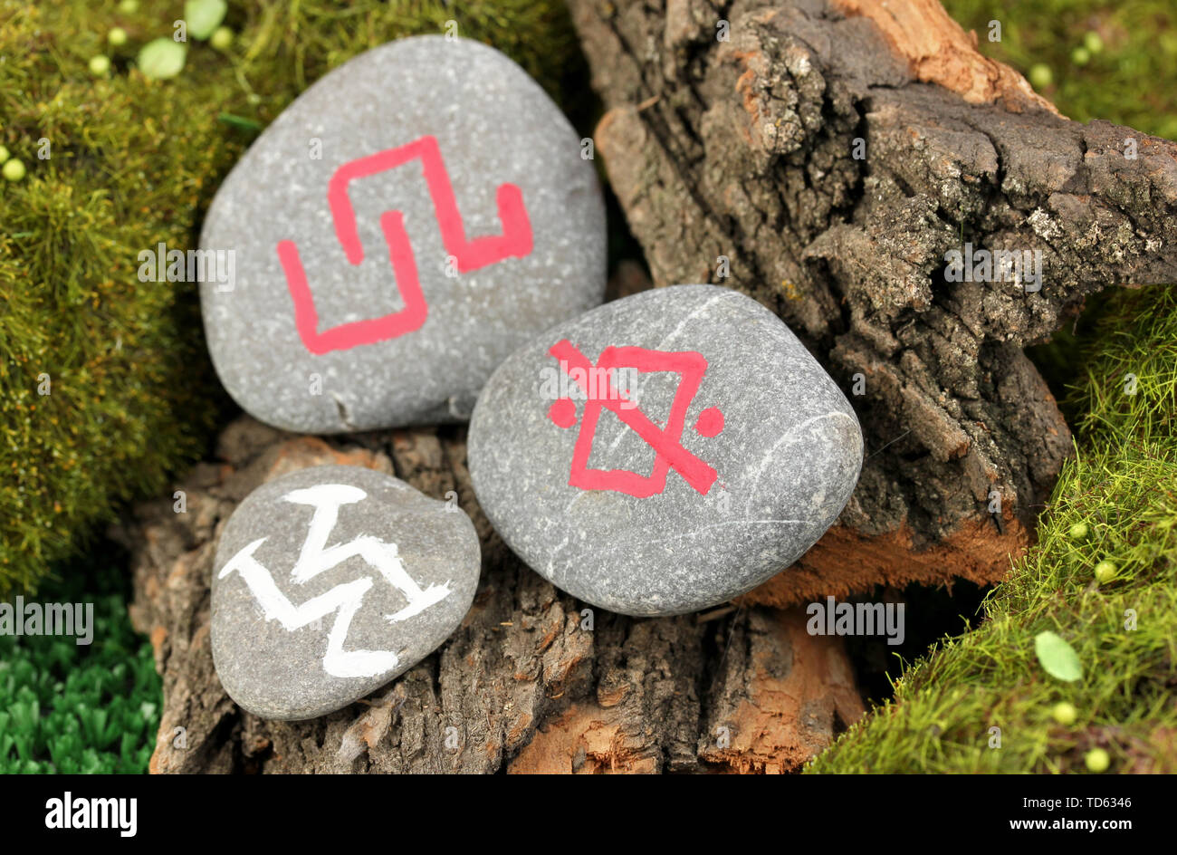 Fortune telling with symbols on stone close up Stock Photo - Alamy