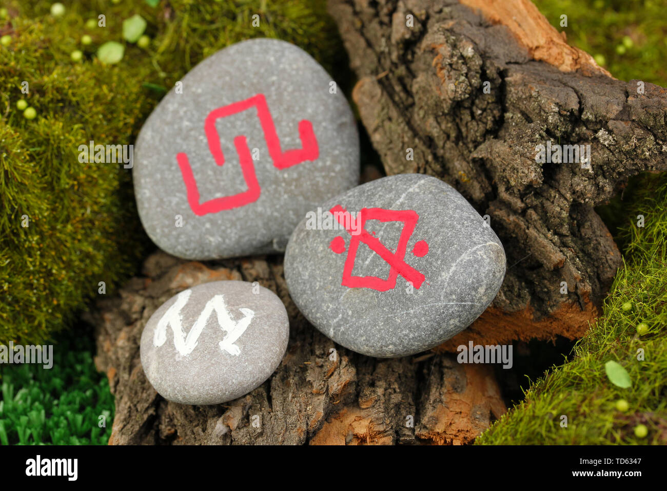 Fortune telling with symbols on stone close up Stock Photo - Alamy