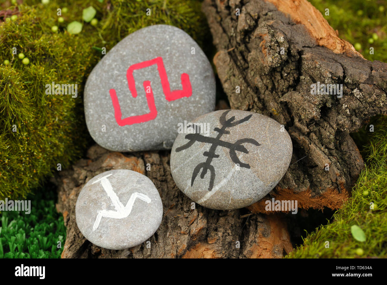 Fortune telling with symbols on stone close up Stock Photo - Alamy