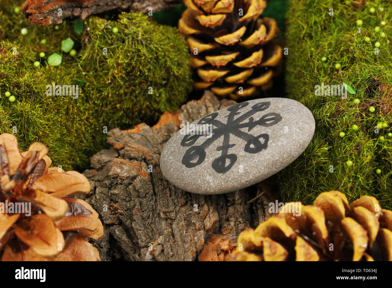 Fortune telling with symbols on stone close up Stock Photo - Alamy