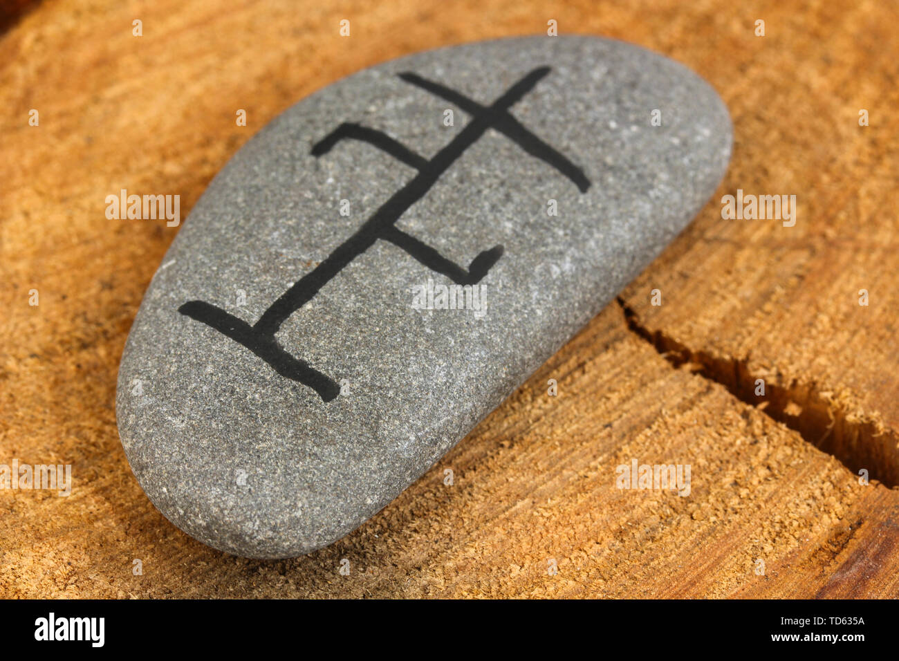 Fortune telling with symbols on stone on wooden background Stock Photo ...