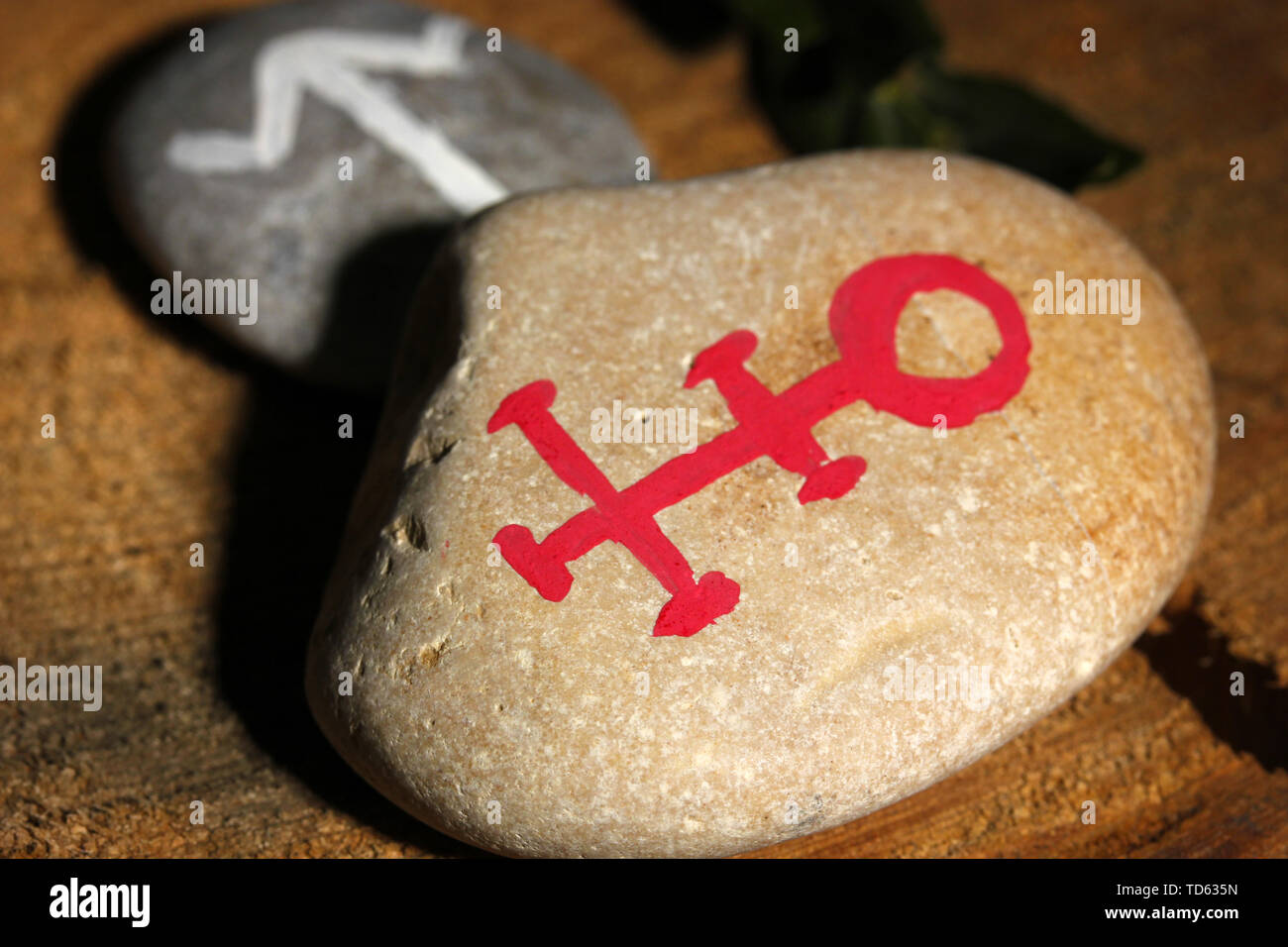 Fortune telling with symbols on stones on wooden background Stock Photo ...