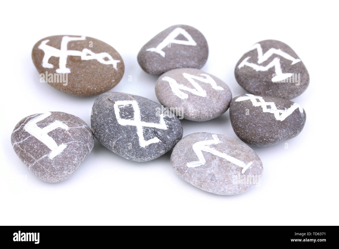 Fortune telling with symbols on stones isolated on white Stock Photo ...