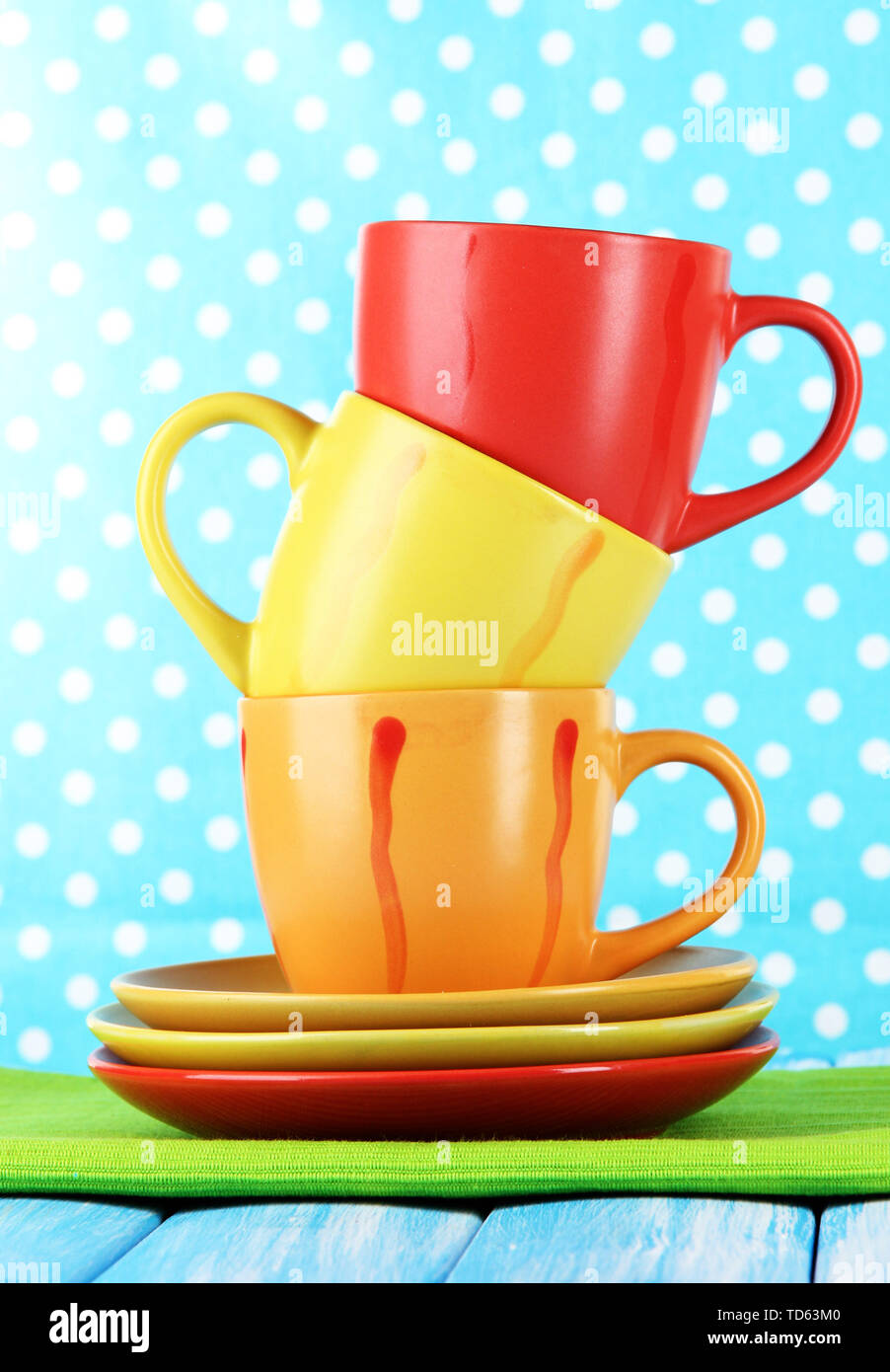 Three cups on bright background Stock Photo - Alamy
