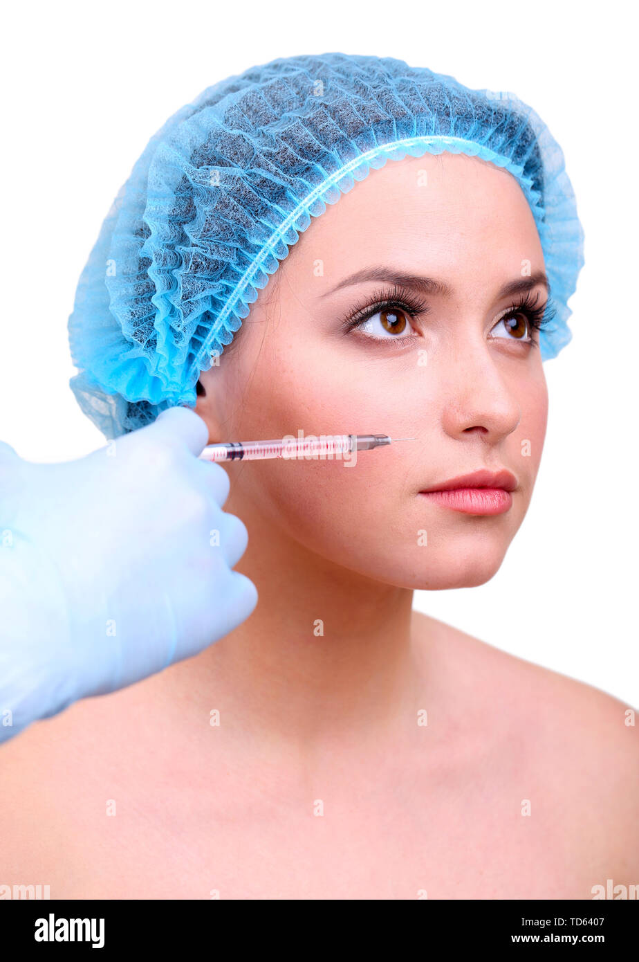 Young woman receiving plastic surgery injection on her face close up ...