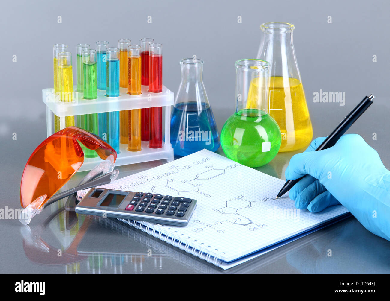 Hand scientist writing formulas Stock Photo - Alamy