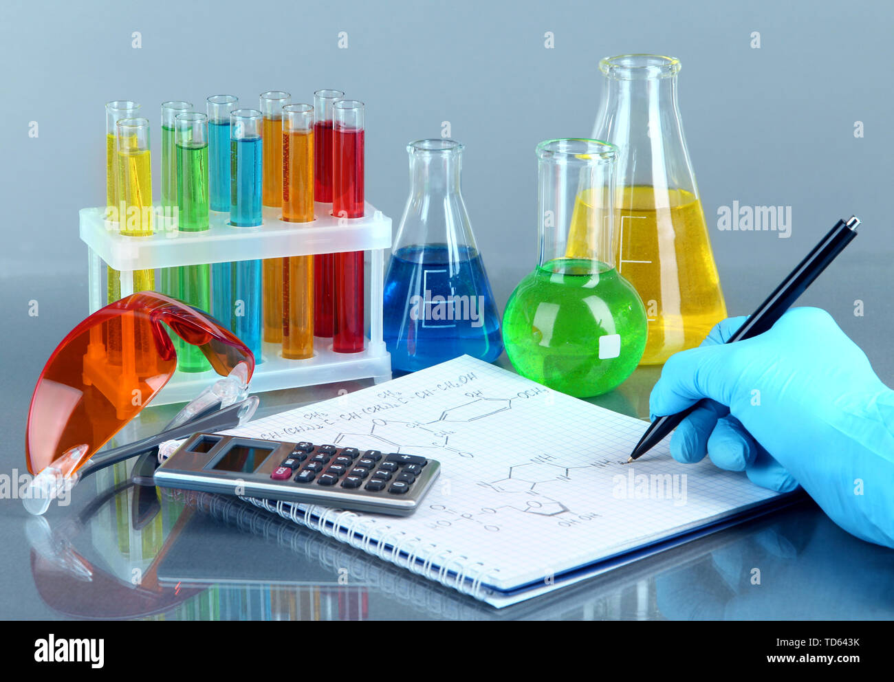 Hand scientist writing formulas Stock Photo - Alamy
