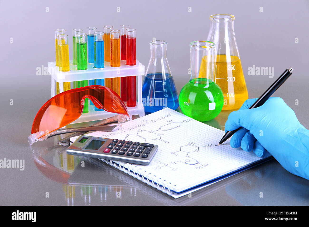 Hand scientist writing formulas Stock Photo - Alamy
