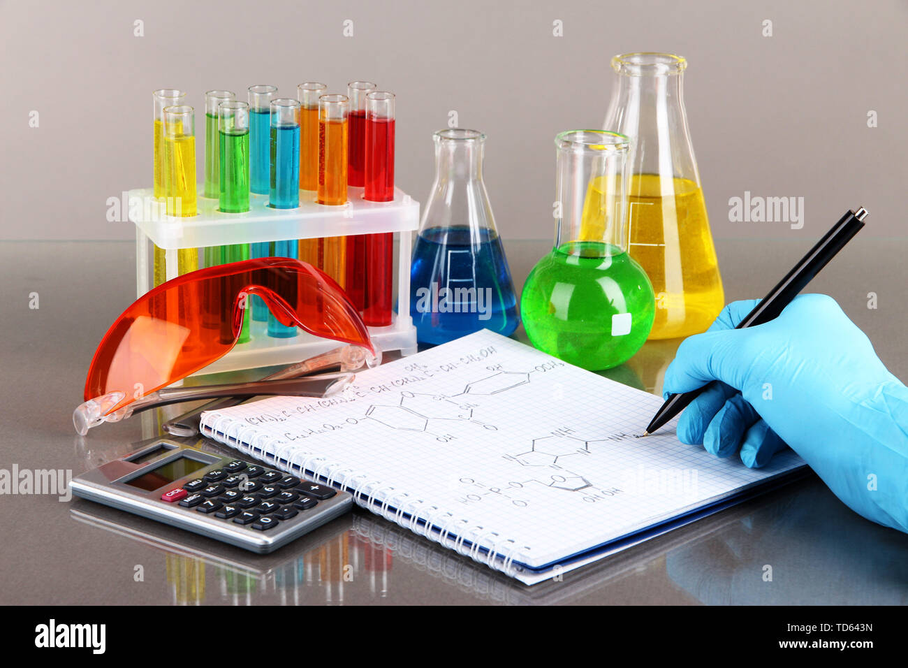 Hand scientist writing formulas Stock Photo - Alamy