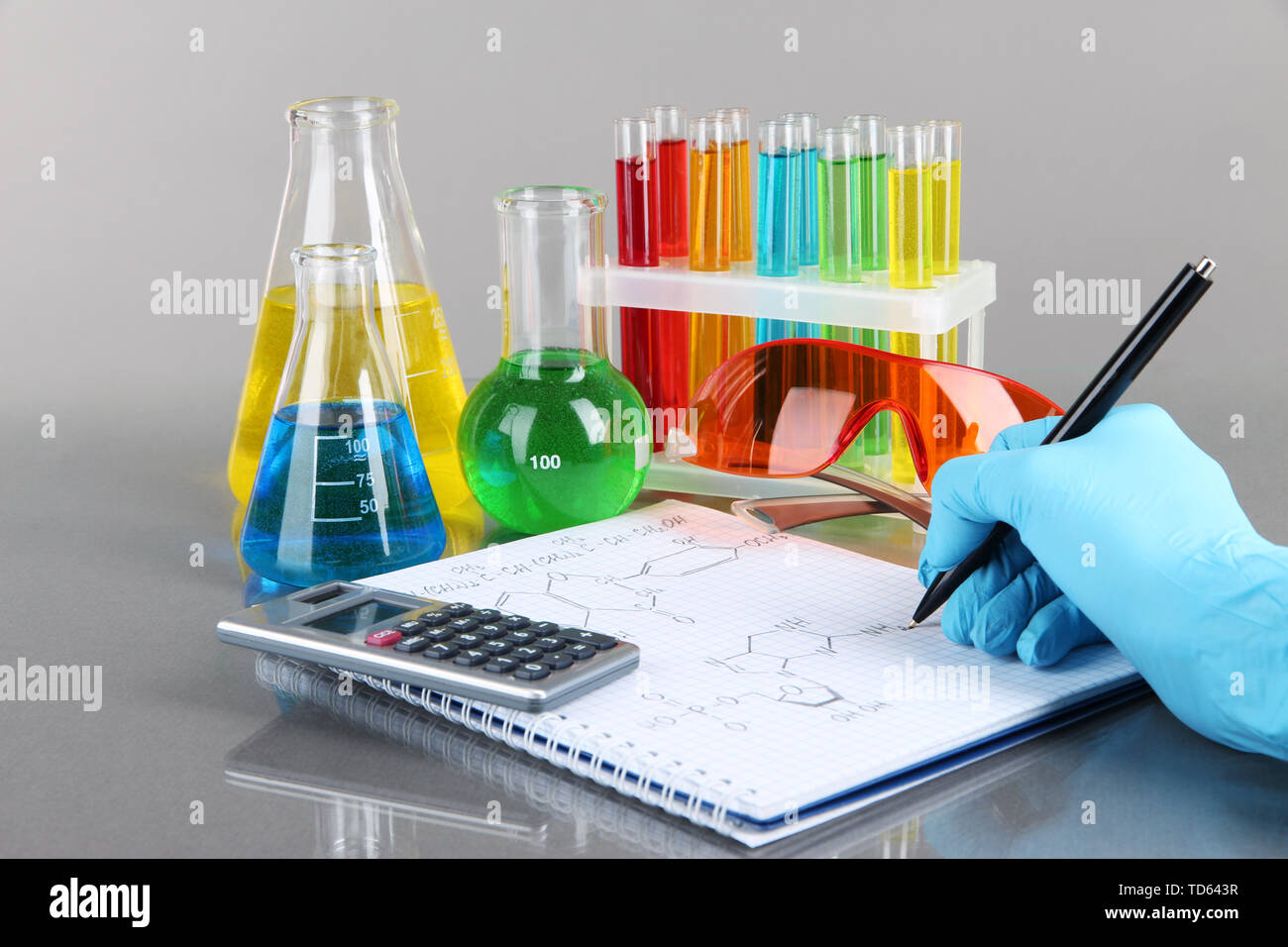Hand scientist writing formulas Stock Photo - Alamy