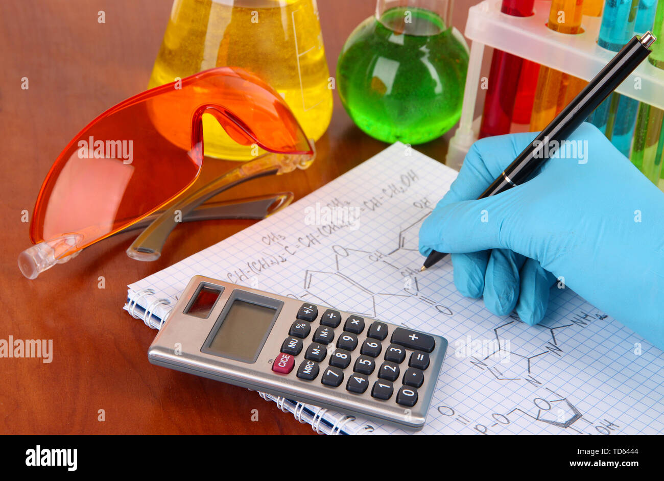 Hand scientist writing formulas Stock Photo - Alamy