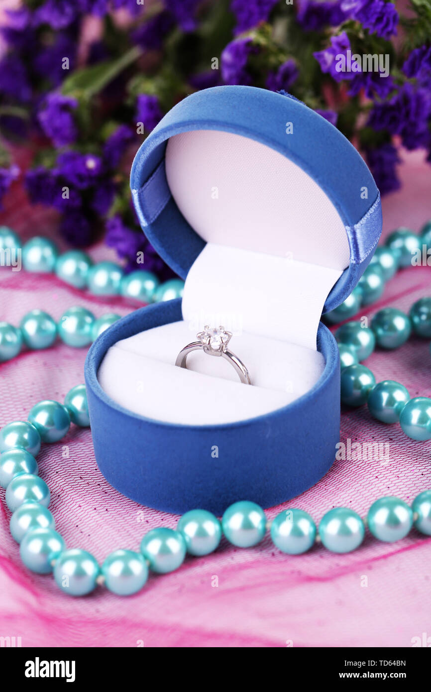 engagement ring on pink cloth Stock Photo - Alamy
