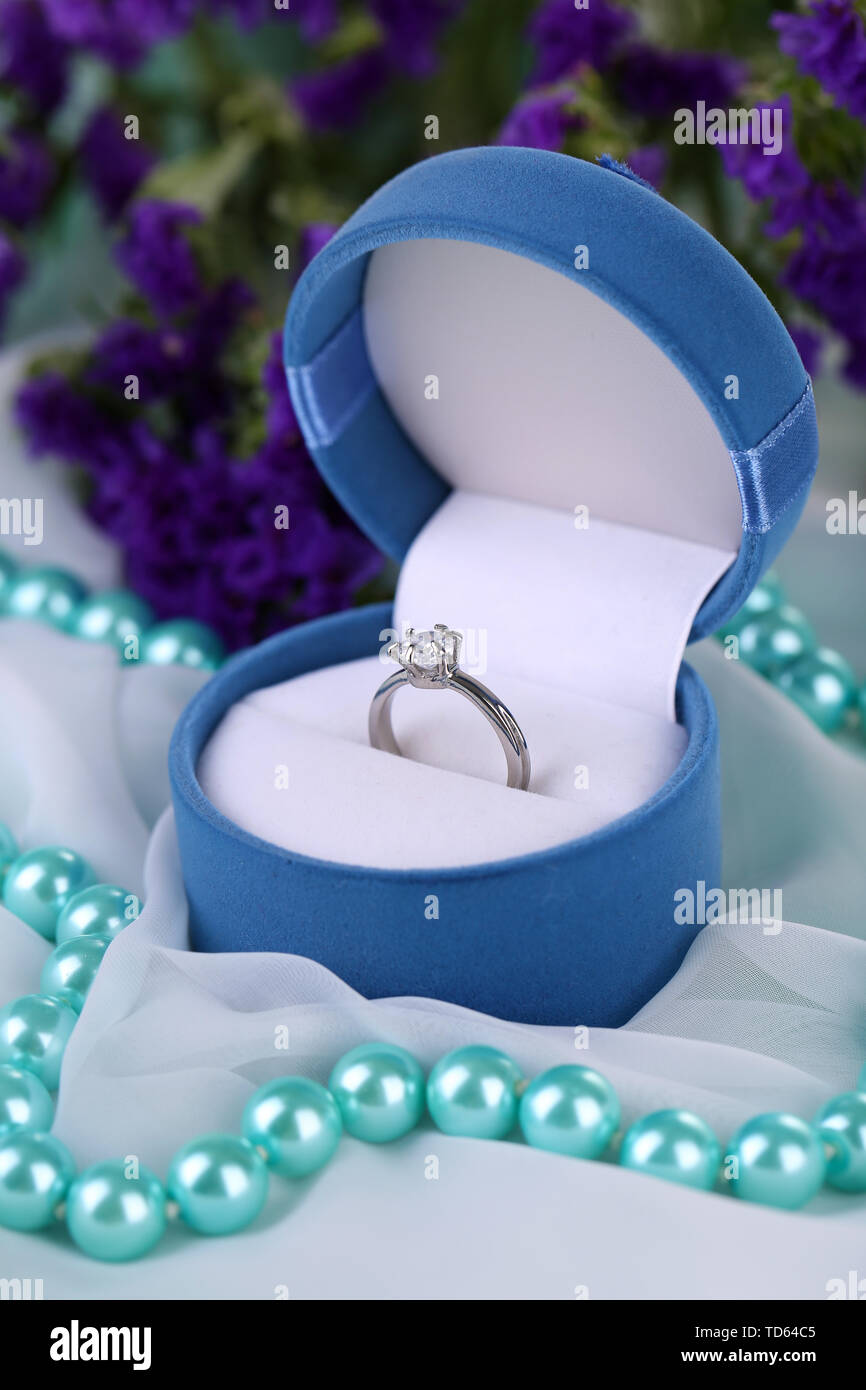 Ring on a white cloth Stock Photo - Alamy