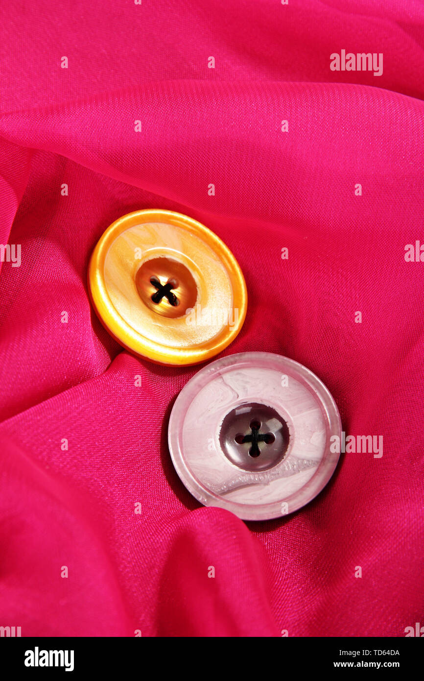 Two buttons on pink background Stock Photo - Alamy