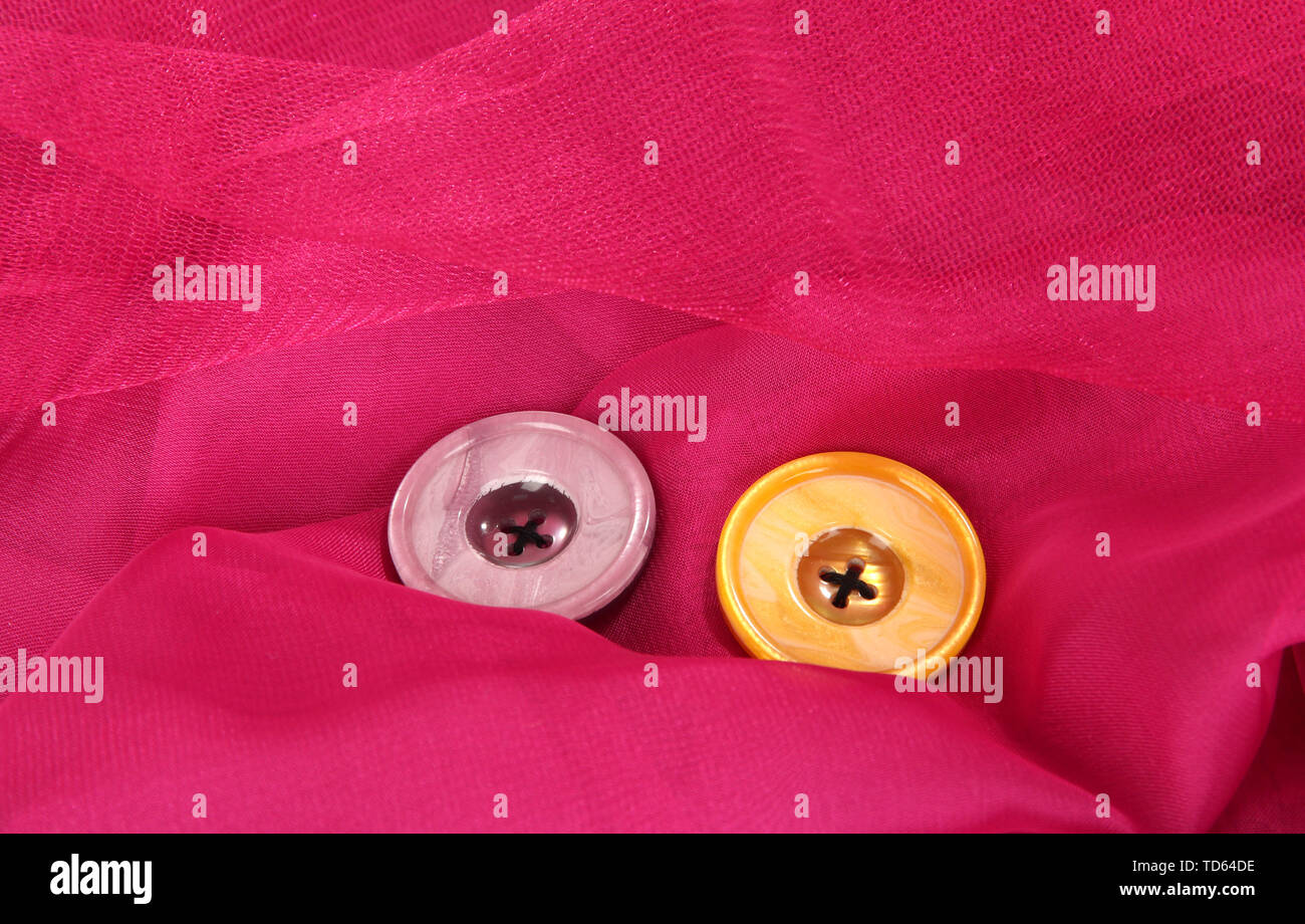 Two buttons on pink background Stock Photo - Alamy
