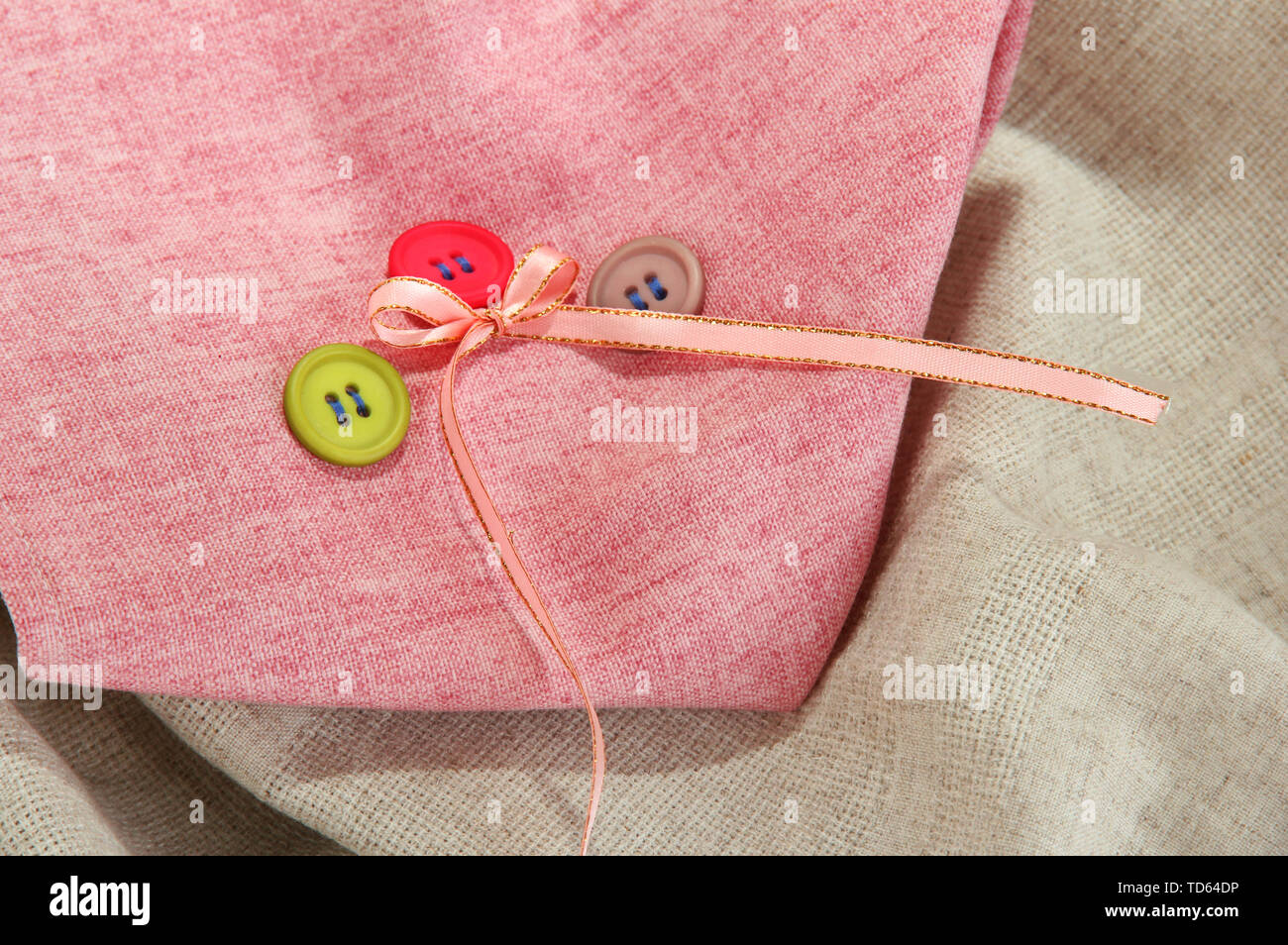 Three buttons on light cloth Stock Photo - Alamy