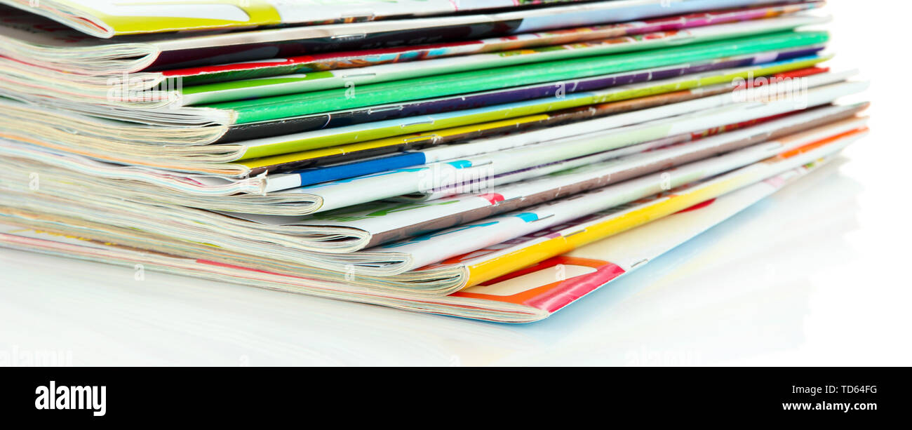 Many magazines isolated on white Stock Photo - Alamy