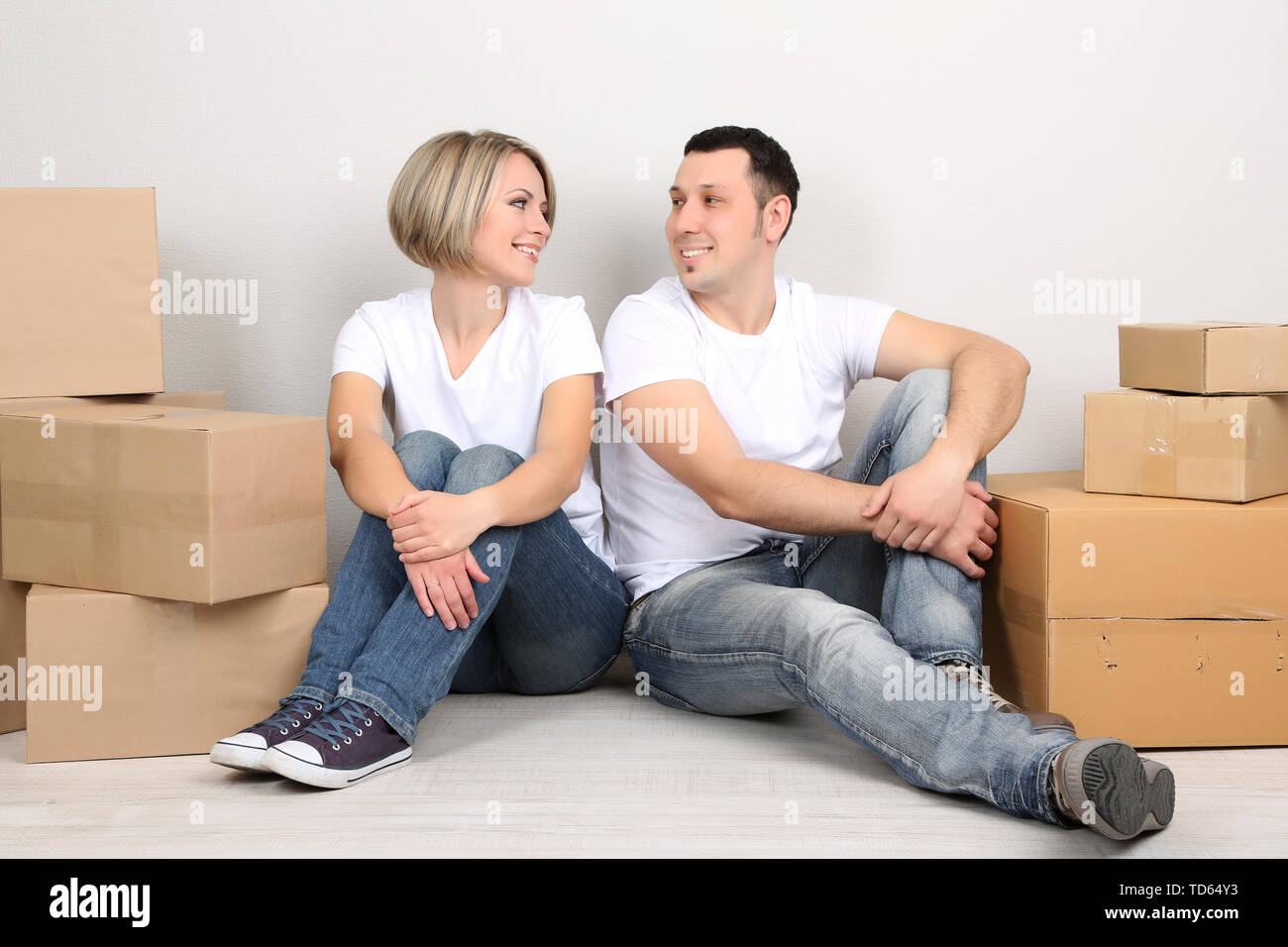 Young couple moving in new house Stock Photo - Alamy