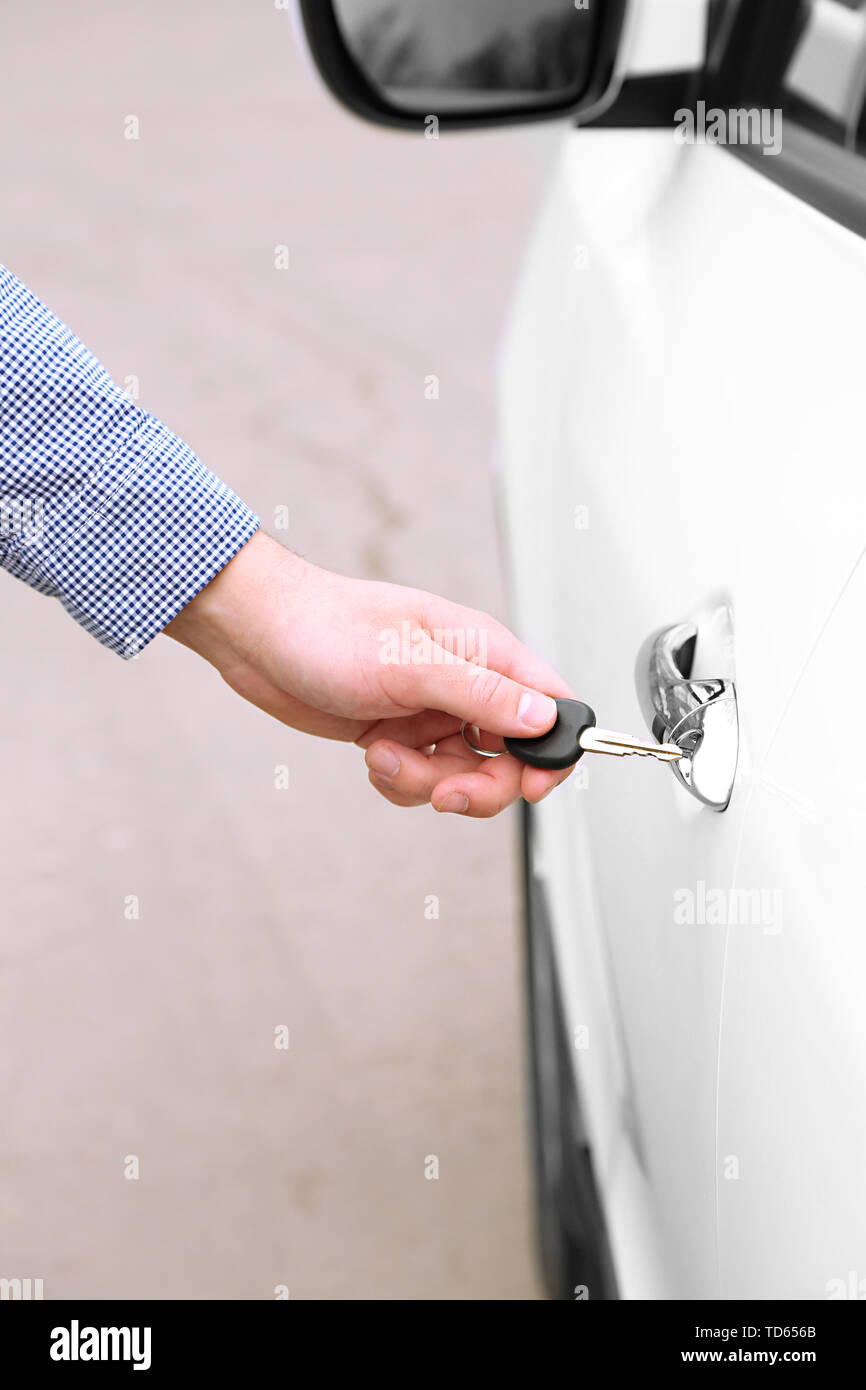 Man hand opening car door, close up Stock Photo - Alamy
