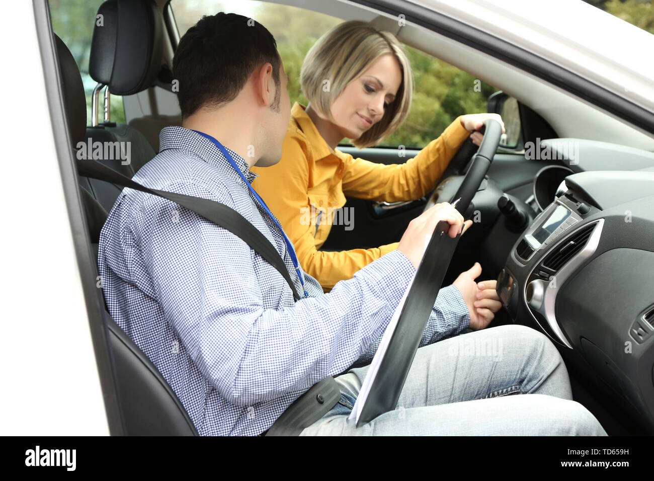 Learner driver student driving car with instructor Stock Photo - Alamy
