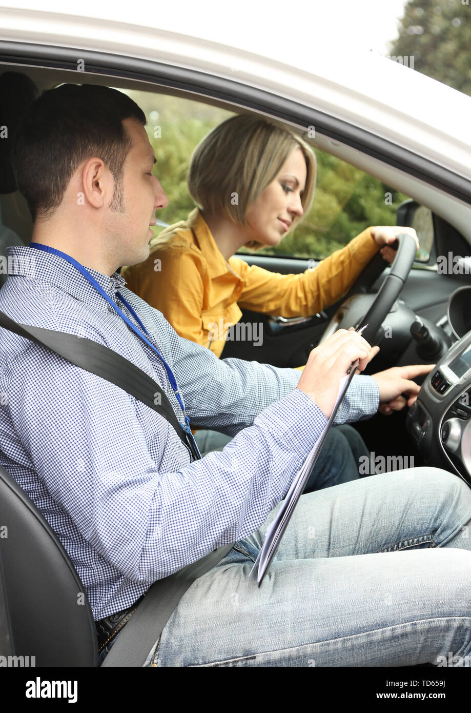 Learner driver student driving car with instructor Stock Photo - Alamy