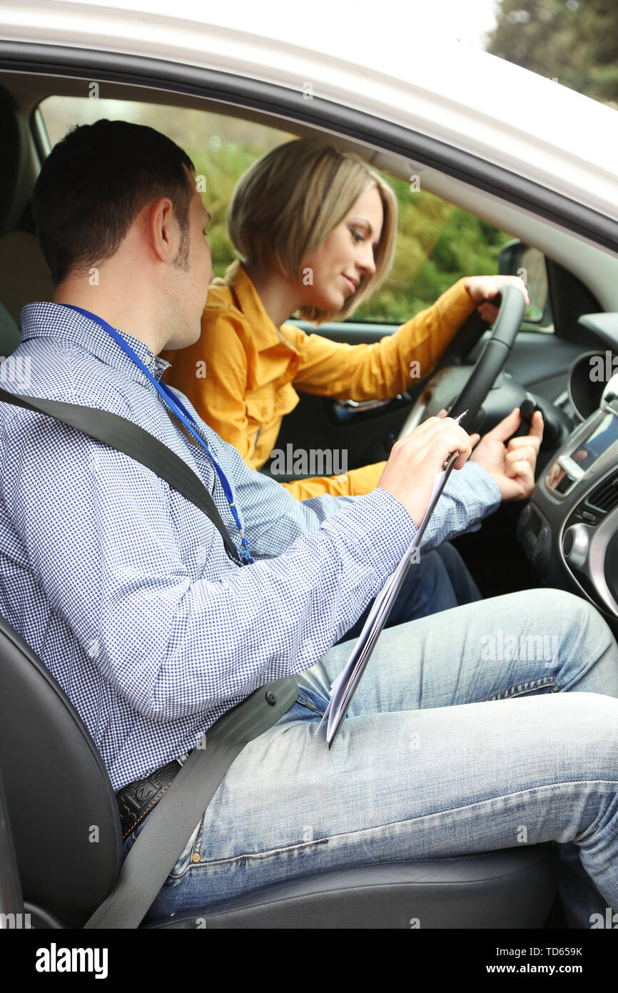 Learner driver student driving car with instructor Stock Photo - Alamy