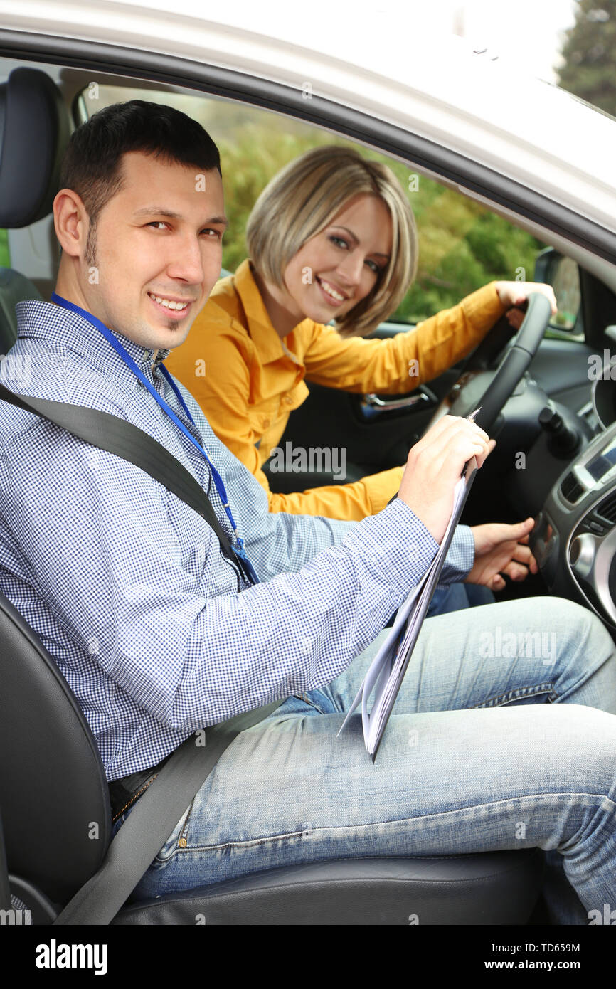 Learner driver student driving car with instructor Stock Photo - Alamy