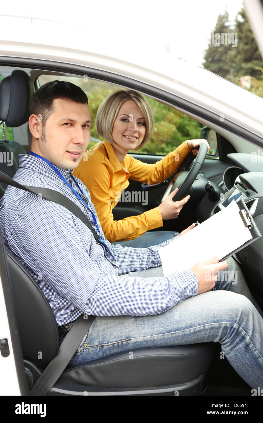 Learner driver student driving car with instructor Stock Photo - Alamy