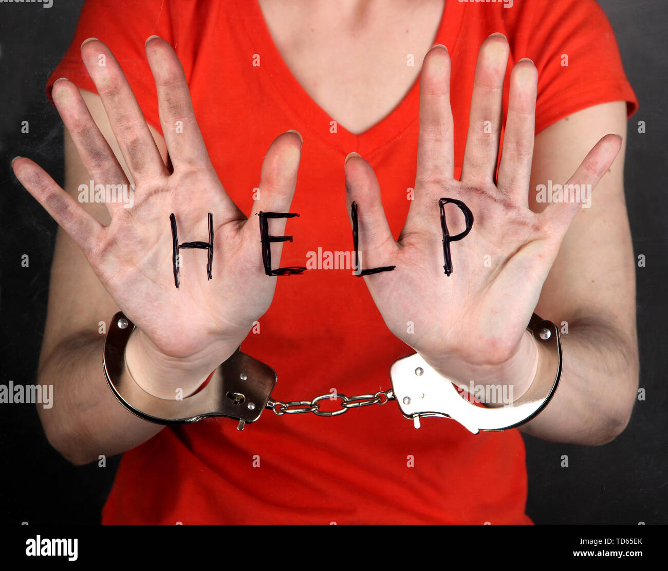 Prisoner in handcuffs behind glass in soundproof room Stock Photo - Alamy