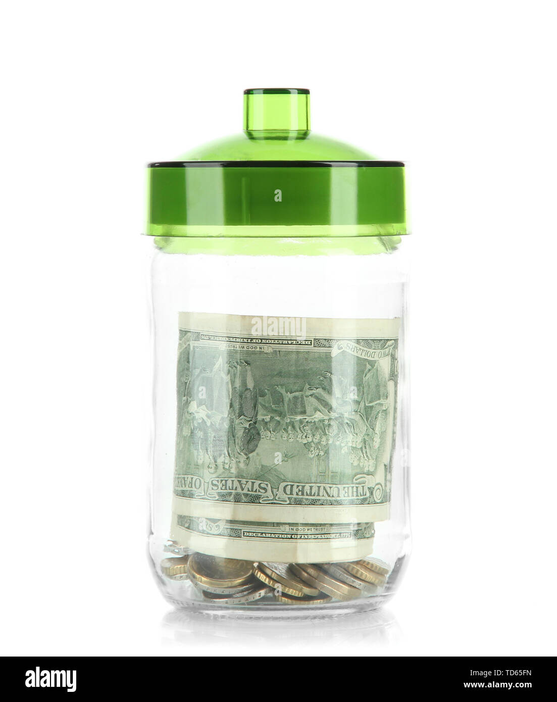 Glass jar with money isolated on white Stock Photo - Alamy