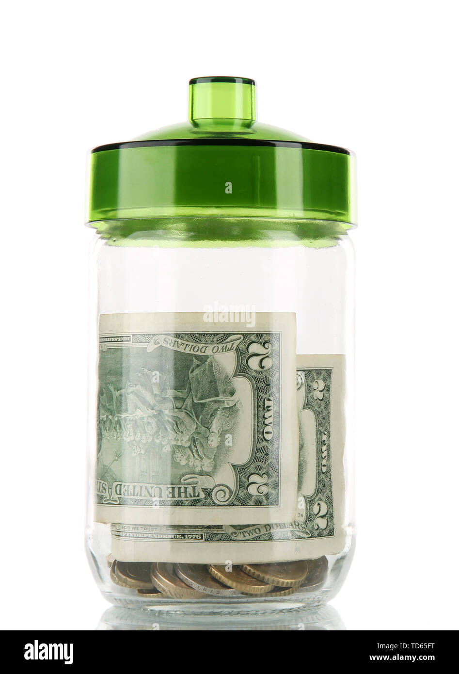 Glass jar with money isolated on white Stock Photo - Alamy