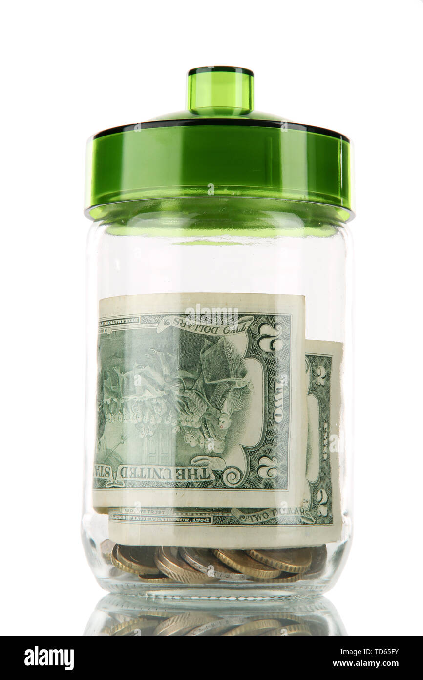 Glass jar with money isolated on white Stock Photo - Alamy