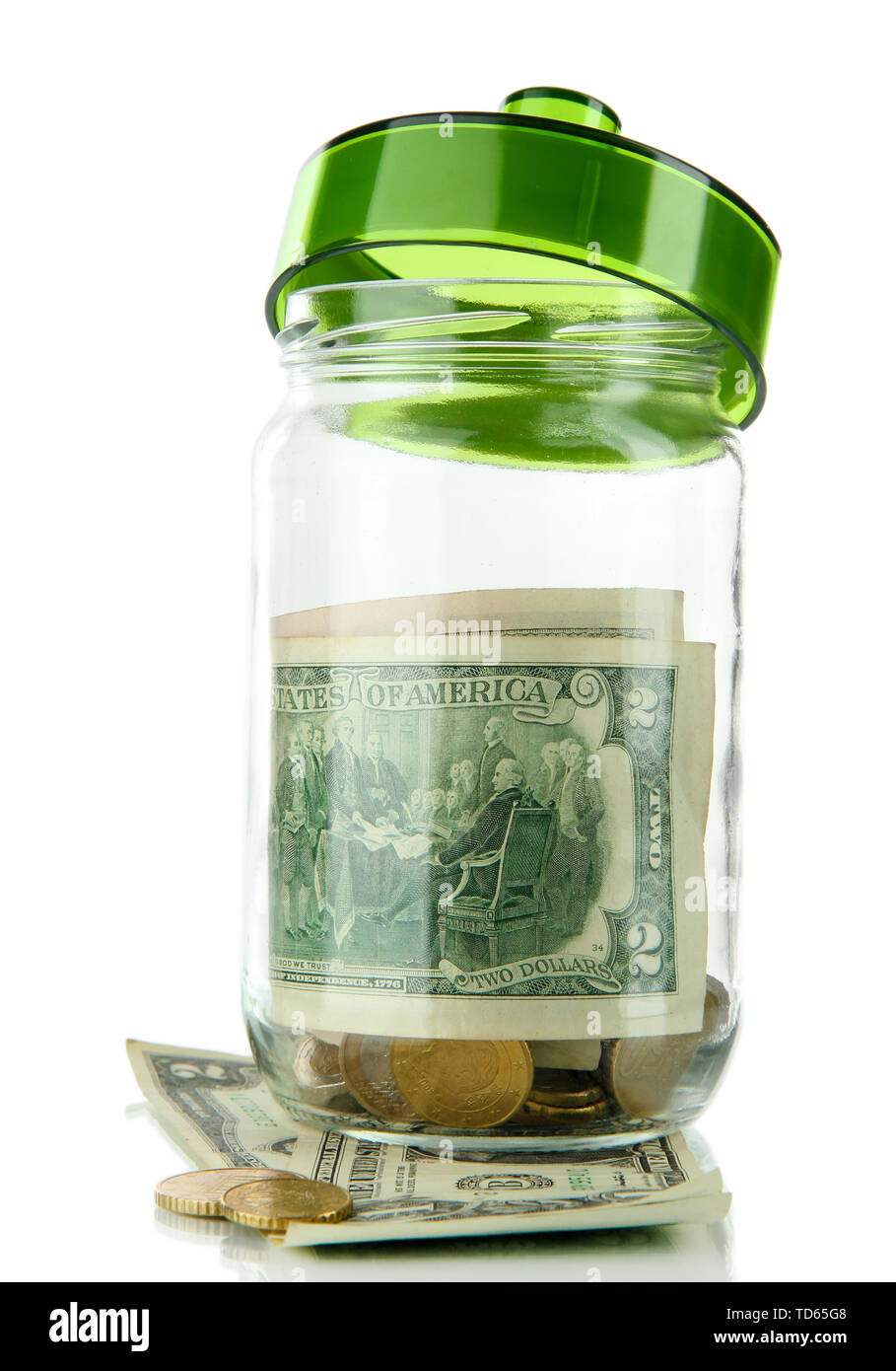 Glass jar with money isolated on white Stock Photo - Alamy