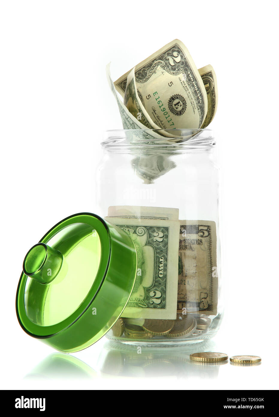Glass jar with money isolated on white Stock Photo - Alamy