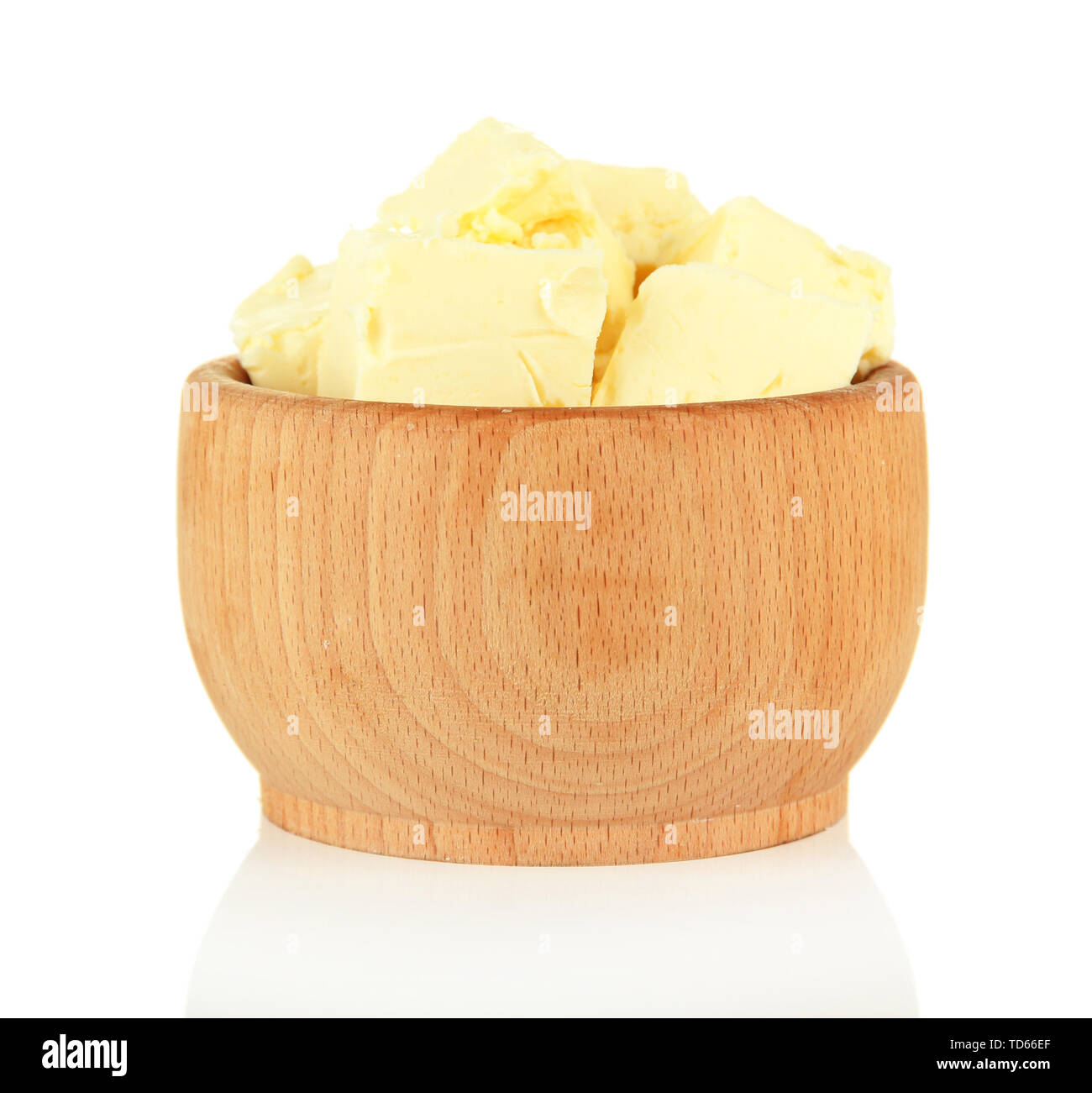Butter pieces in wooden bowl, isolated on white Stock Photo - Alamy