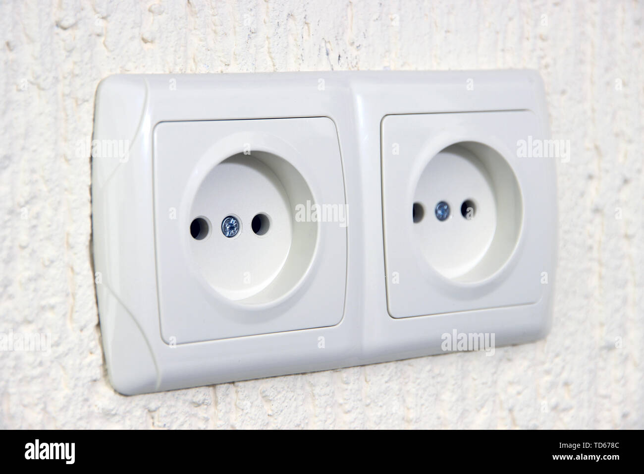 Two sockets on wall Stock Photo - Alamy
