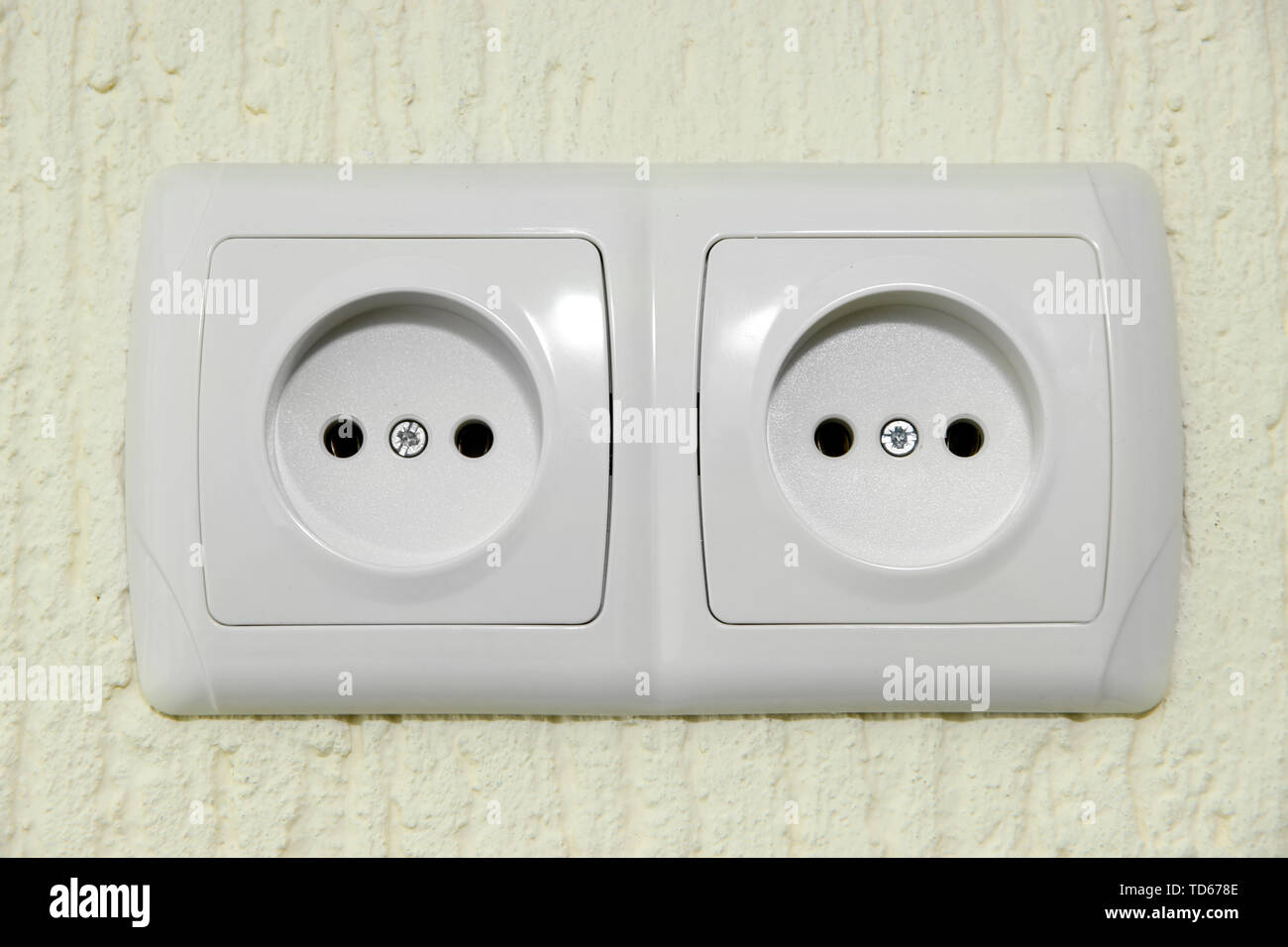Two sockets on wall Stock Photo - Alamy