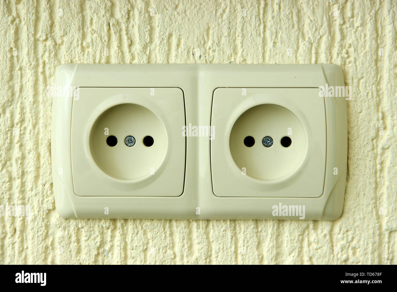 Two sockets on wall Stock Photo - Alamy