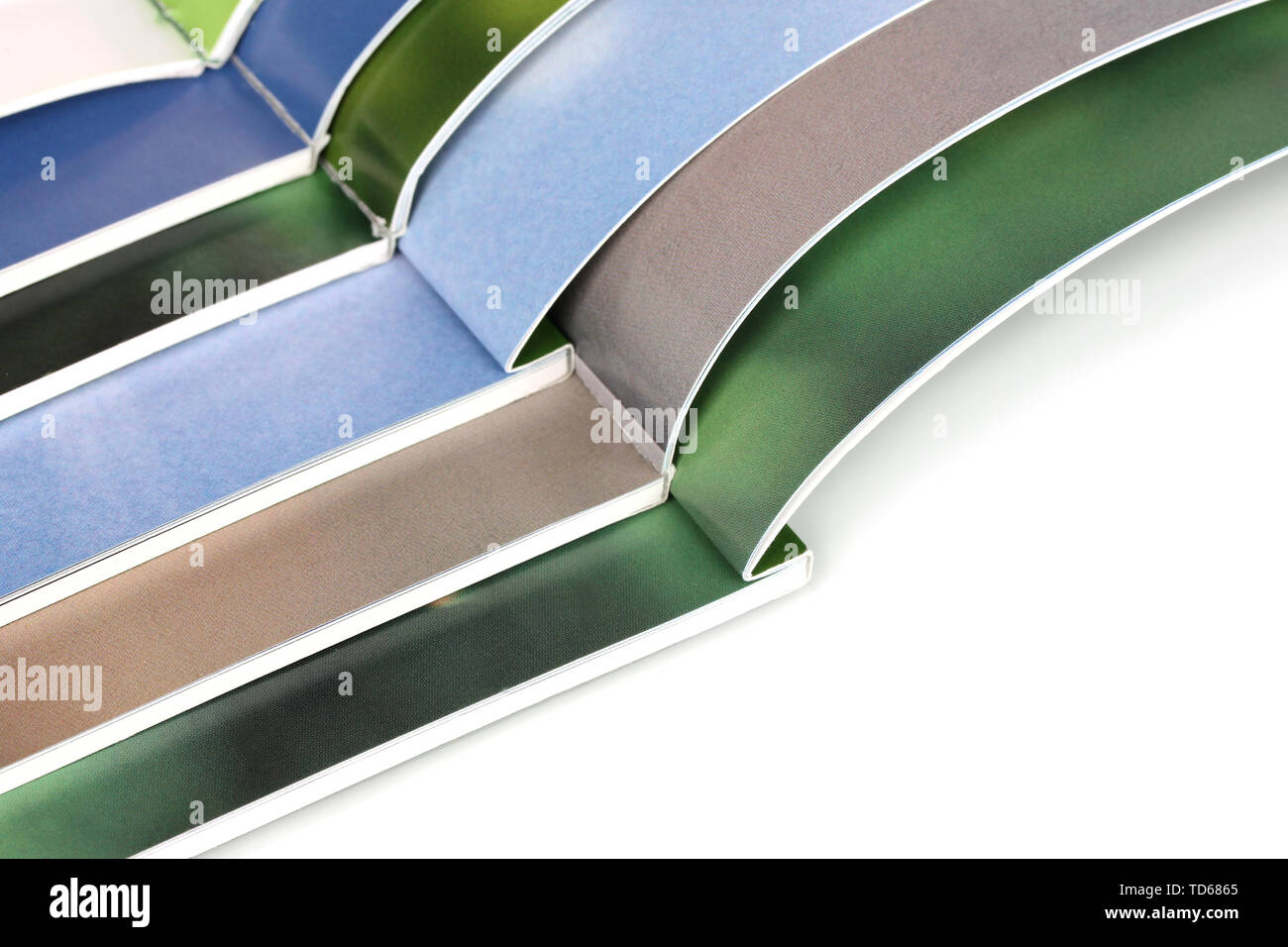Many bright open magazines close-up Stock Photo - Alamy