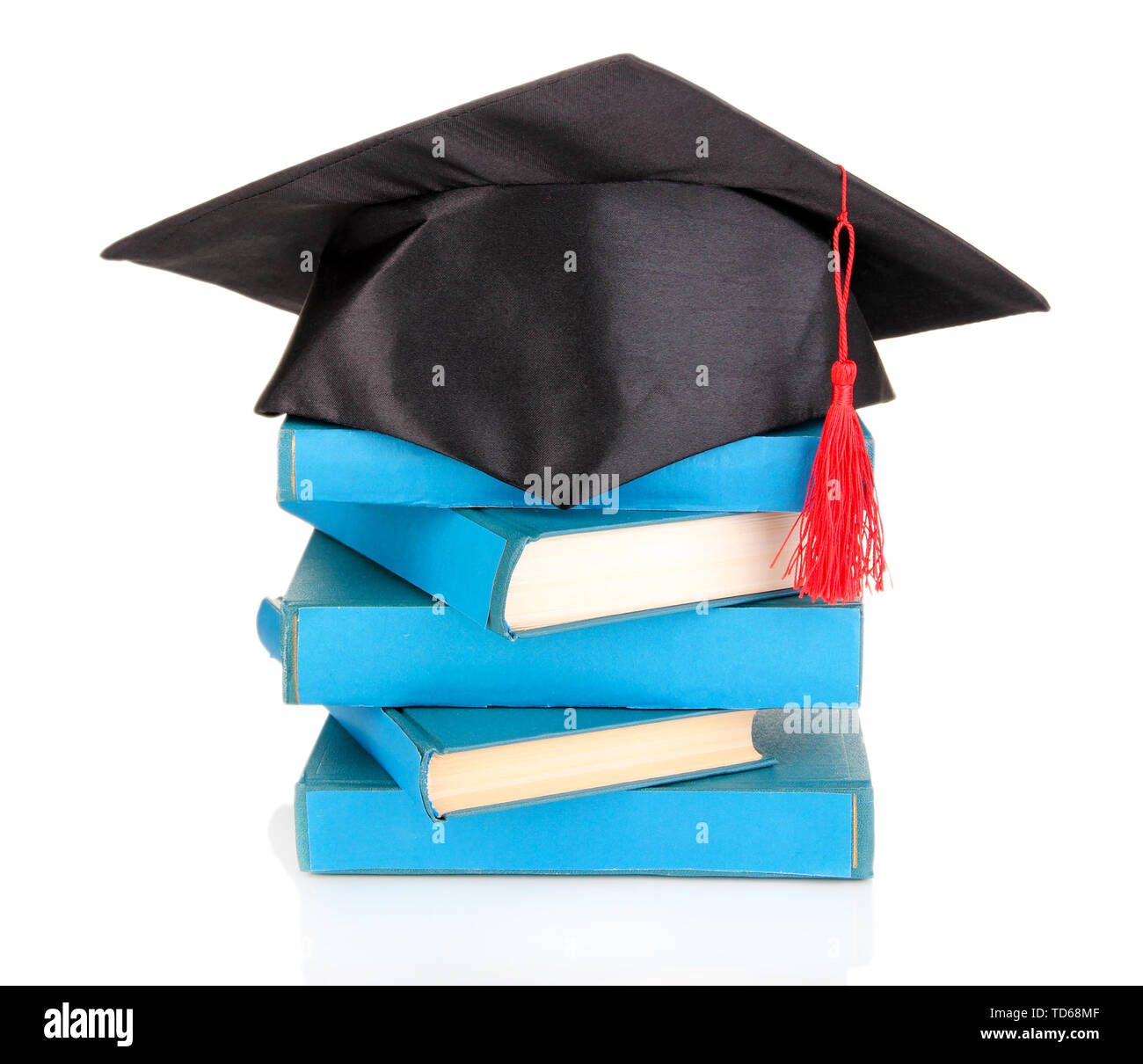 Grad hat with books isolated on white Stock Photo - Alamy
