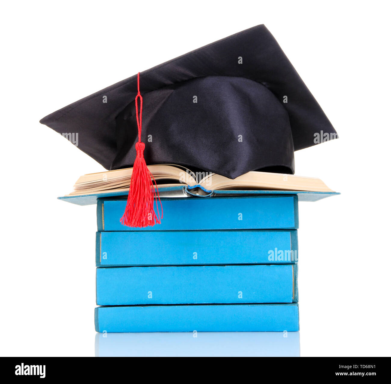 Grad hat with books isolated on white Stock Photo - Alamy