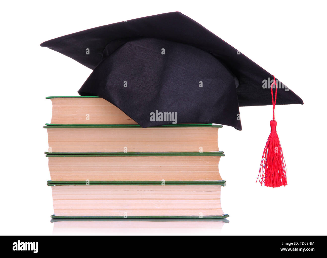 Grad hat with books isolated on white Stock Photo - Alamy