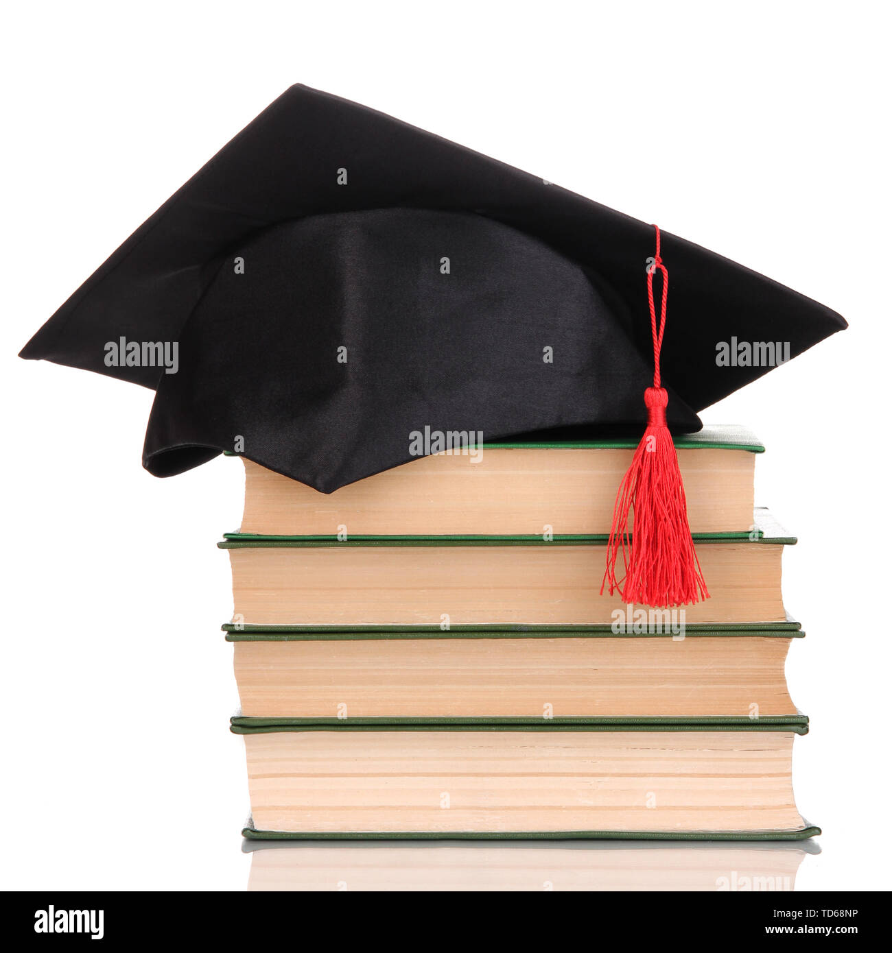 Grad hat with books isolated on white Stock Photo - Alamy