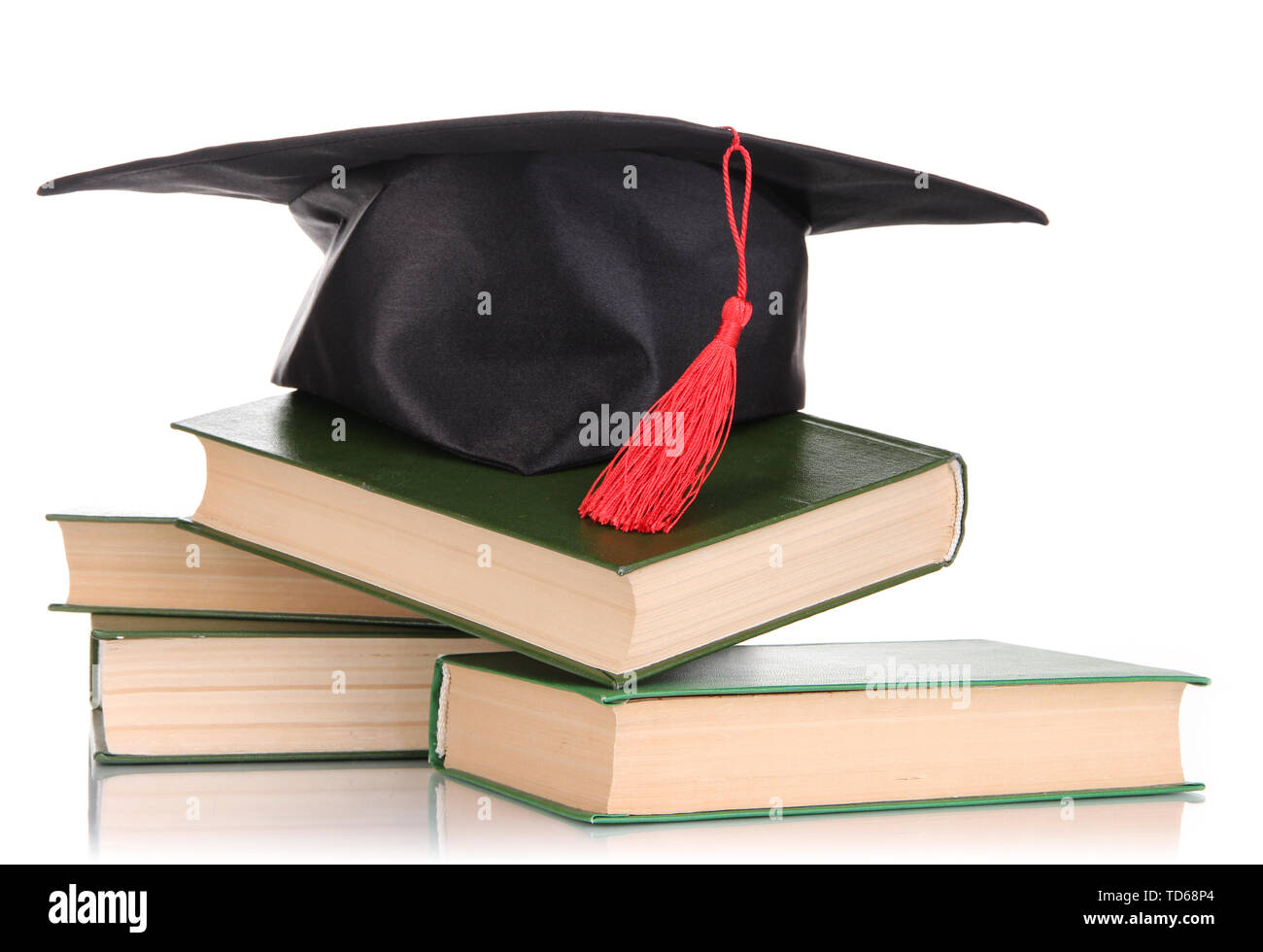 Grad hat with books isolated on white Stock Photo - Alamy