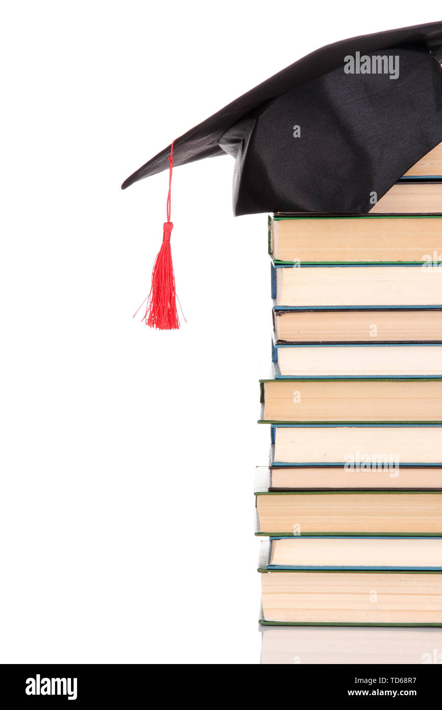 Grad hat with books isolated on white Stock Photo - Alamy