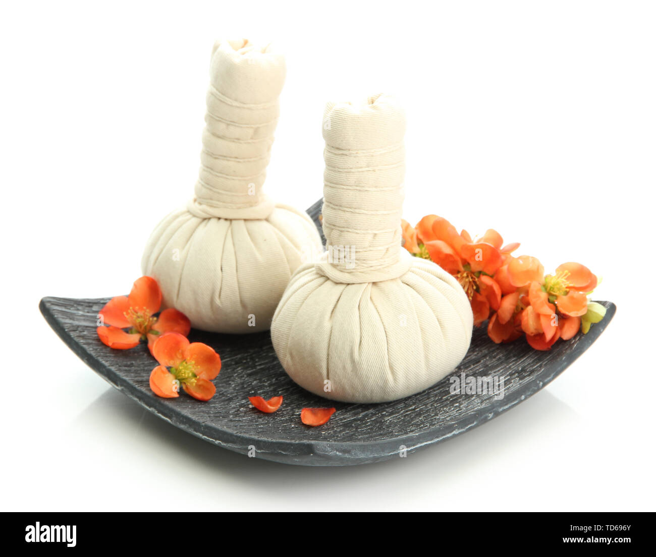 Herbal compress balls for spa treatment and flowers isolated on white ...