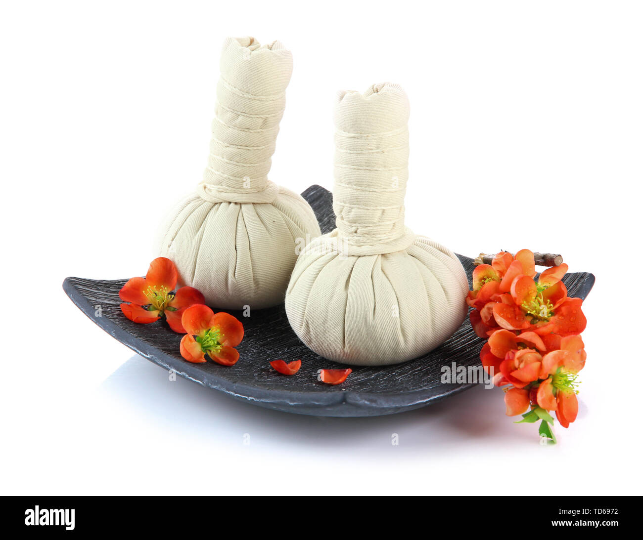Herbal compress balls for spa treatment and flowers isolated on white ...