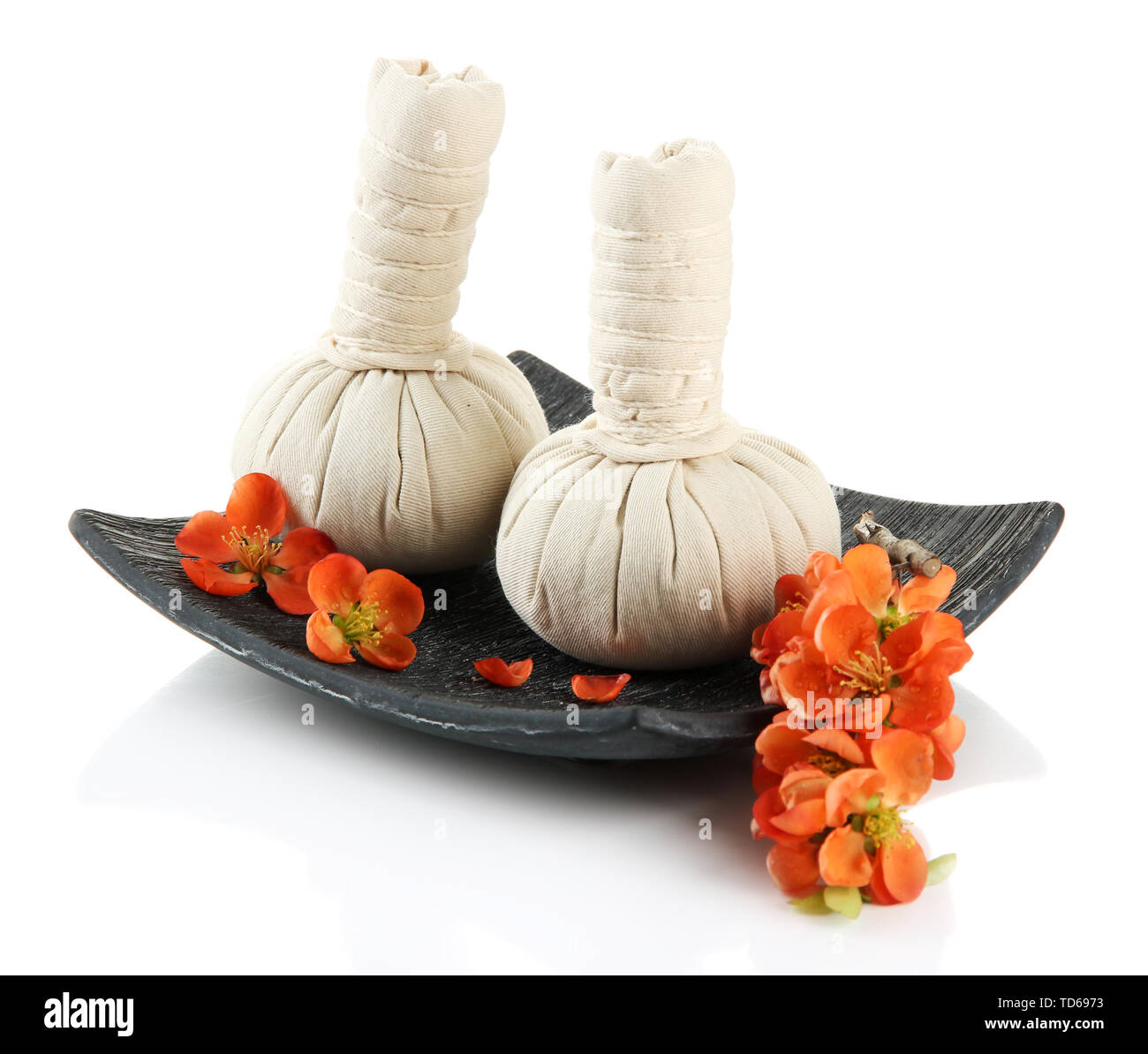 Herbal compress balls for spa treatment and flowers isolated on white ...